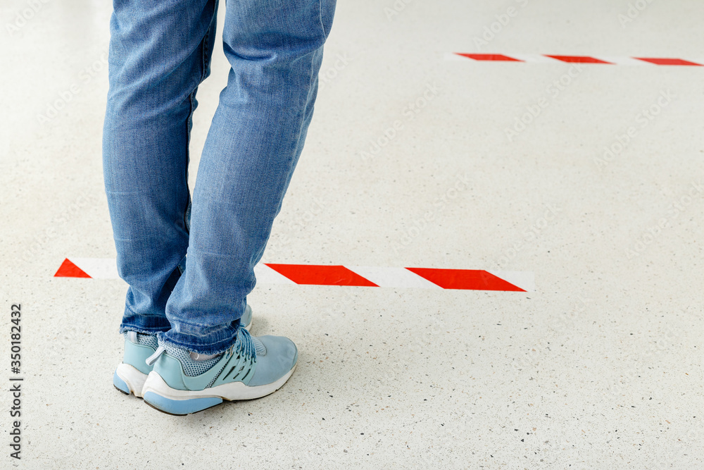 Man stand in line keeping social distance, People standing behind a ...