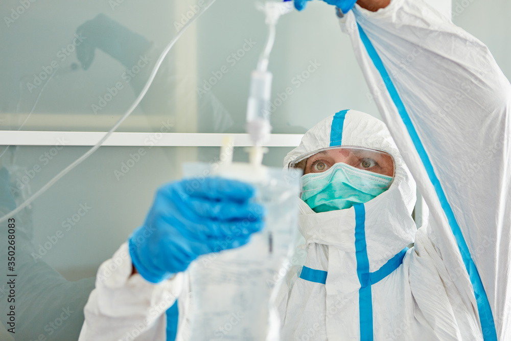 Intensive care clinic staff is preparing infusion for Covid-19 patients ...