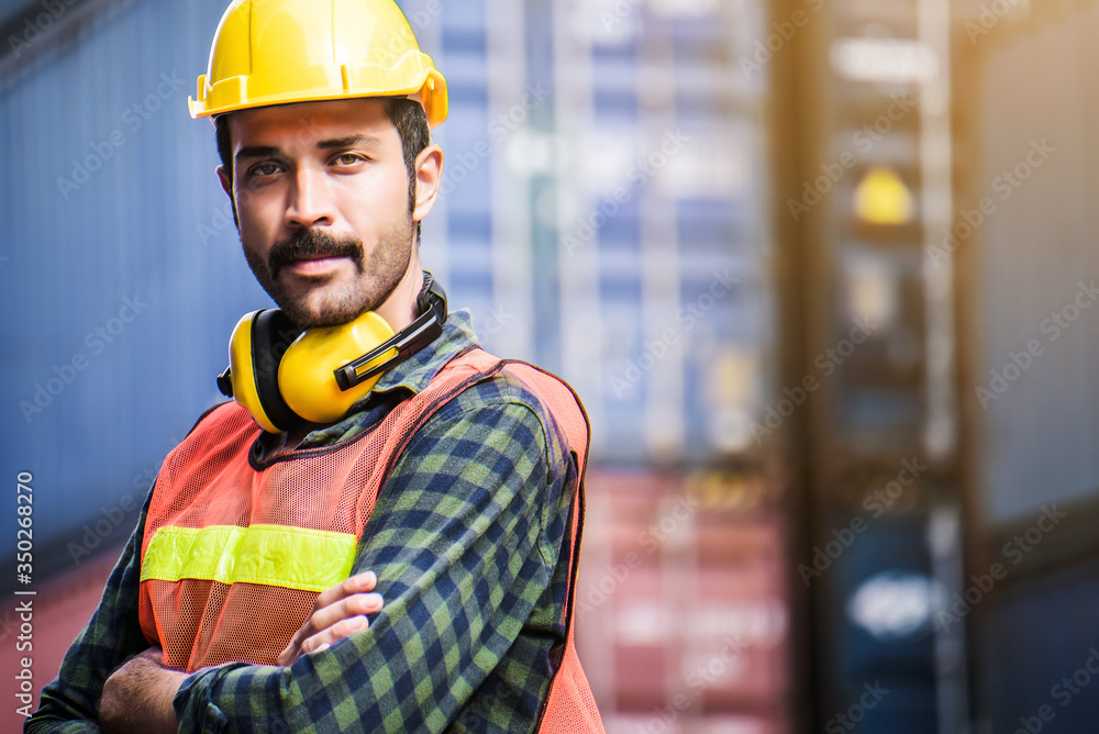 Confident Caucasian man engineer wearing yellow safety helmet and check ...