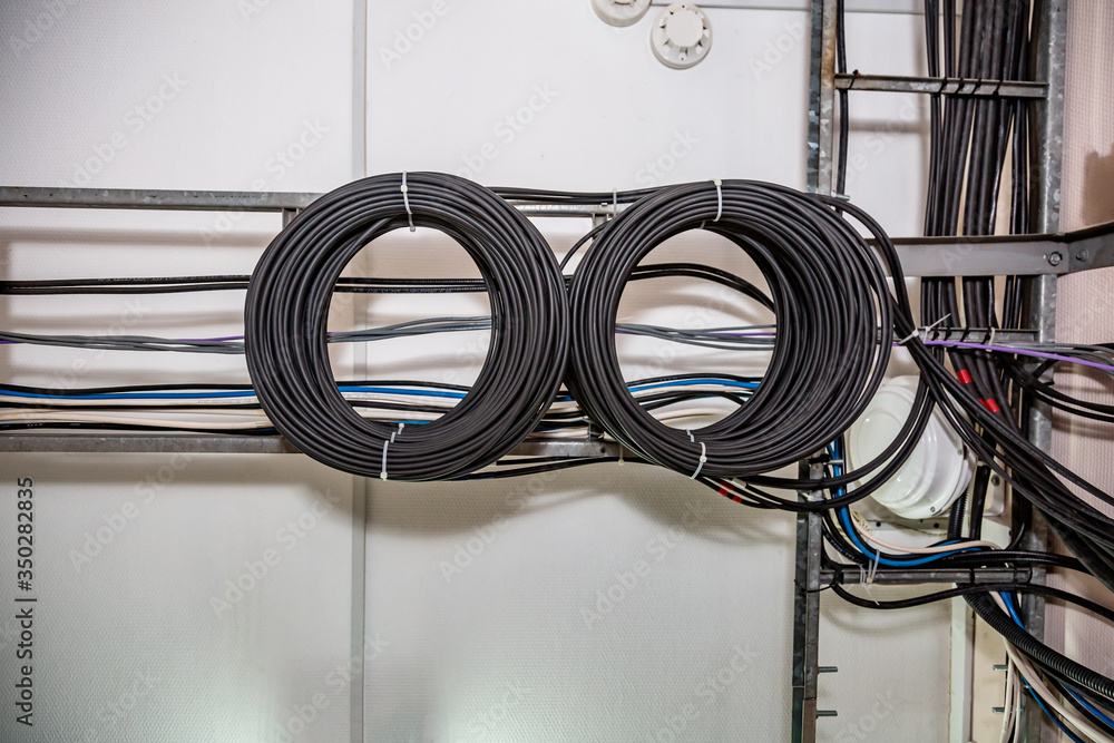 Cable management. Working wires, cables wound into a coil, a circle ...