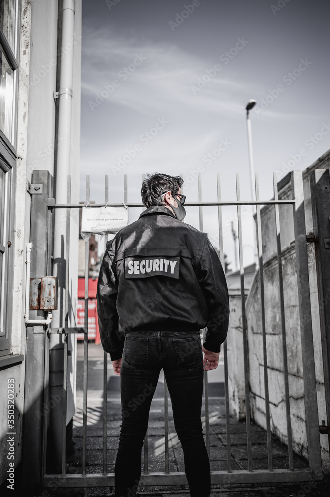 Male security person in black security outfil and black face mask Stock ...