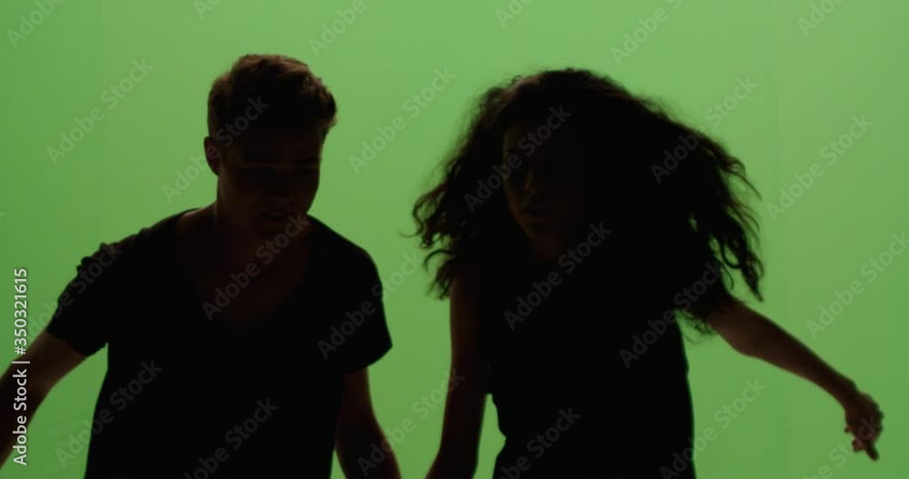Distressed couple woman and man running away and hiding from explosion ...
