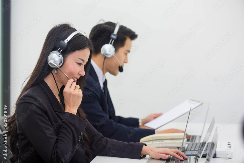 Asian call center staff. Call to talk to customers with friendly ...