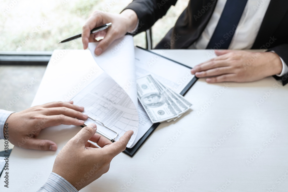 Businessman giving bribe money in the envelope of their partner to give ...