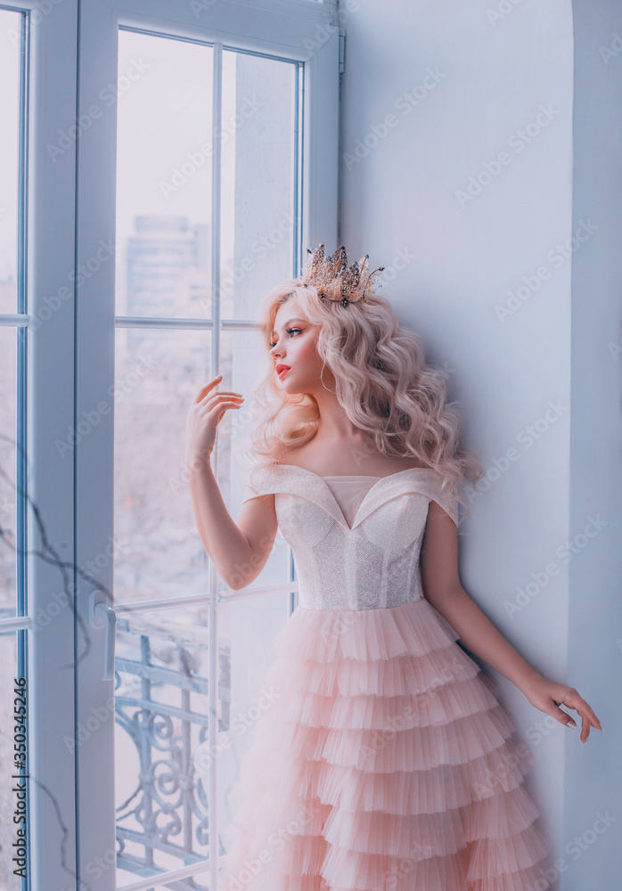 Beautiful young sad fairy tale cute queen woman stand near vintage ...