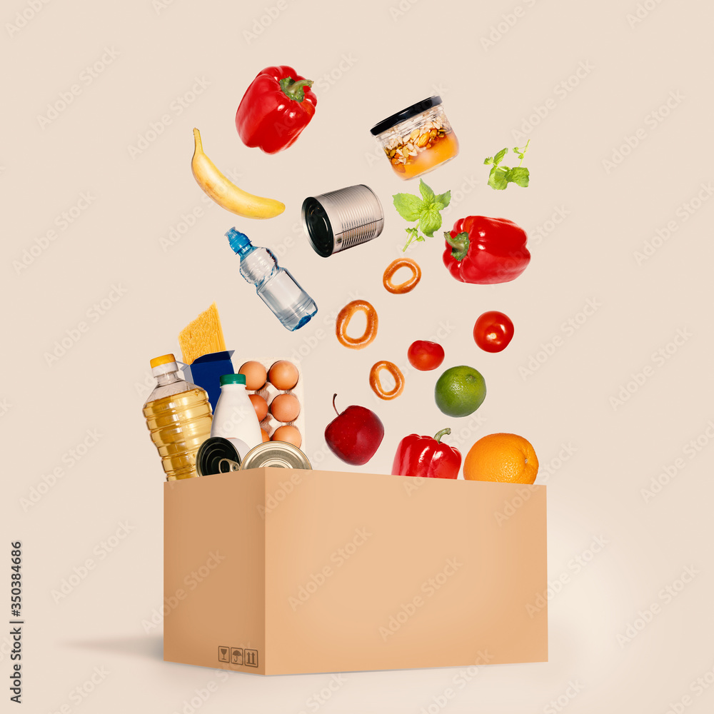 Food delivery concept. Donation box fresh vegetables, fruits and food ...