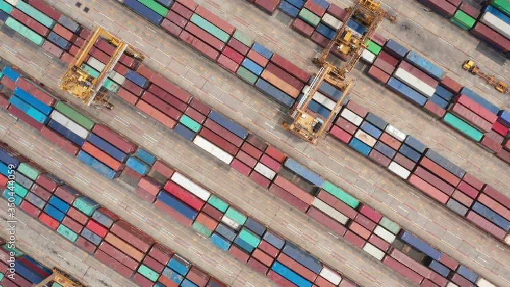 Aerial view of containers yard with ship vessels are loading and ...