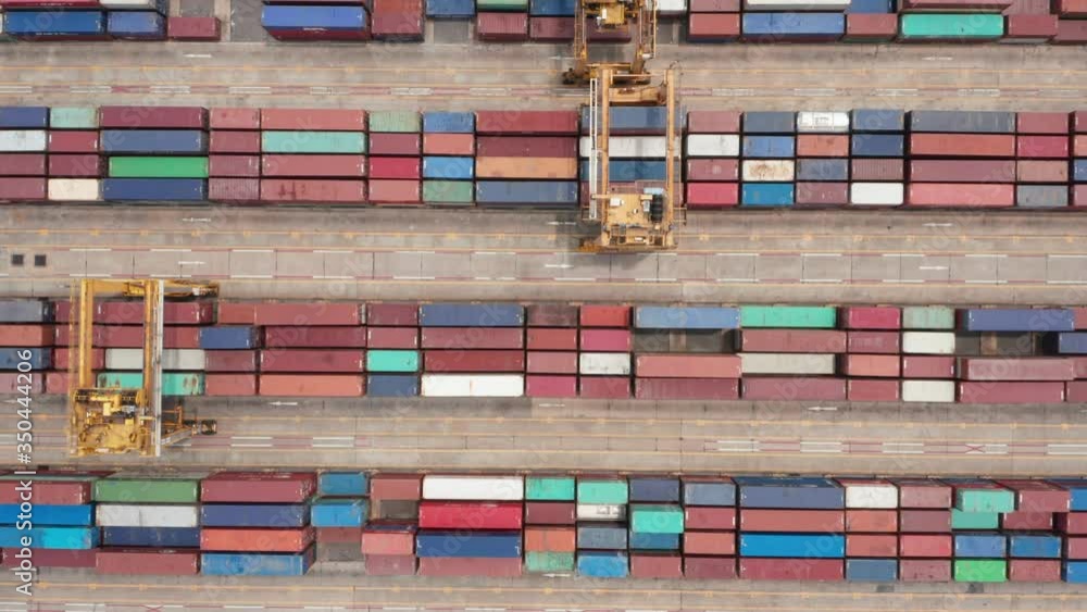 Aerial view of containers yard with ship vessels are loading and ...