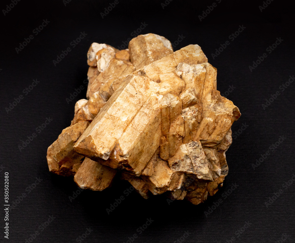 Cluster of feldspar mineral crystals isolated dark background. Geology ...