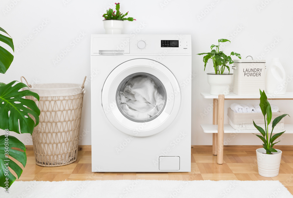 Simple interior of home laundry room with modern washing machine Stock ...