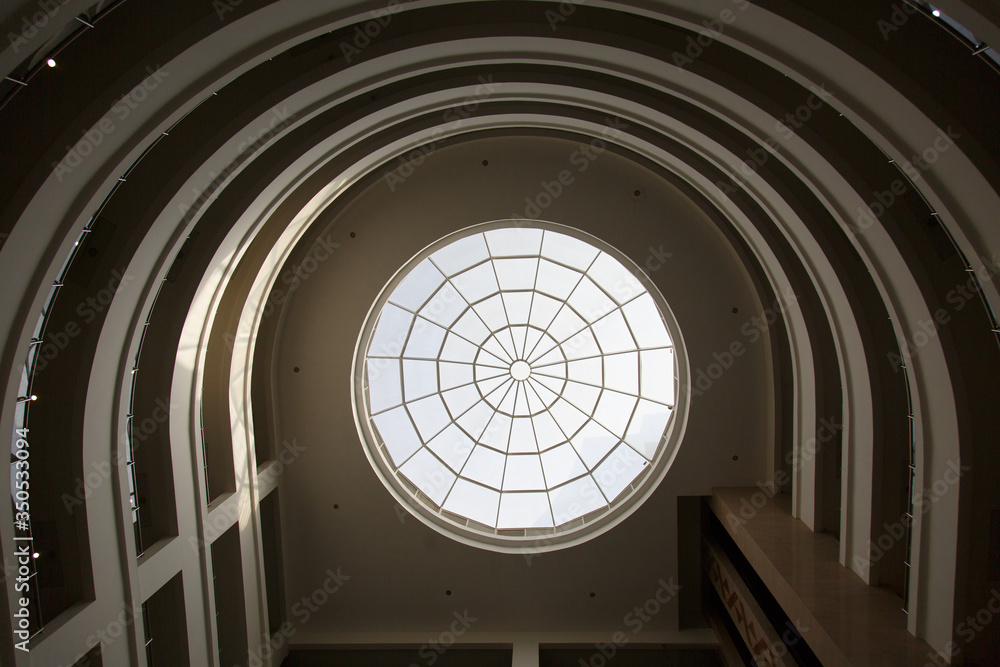 Window to the sky and world. Decorative ceiling. Roof with a figured ...
