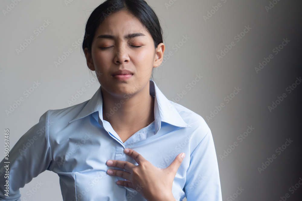 sick woman with indigestion problem, acid reflux or gerd symptoms ...