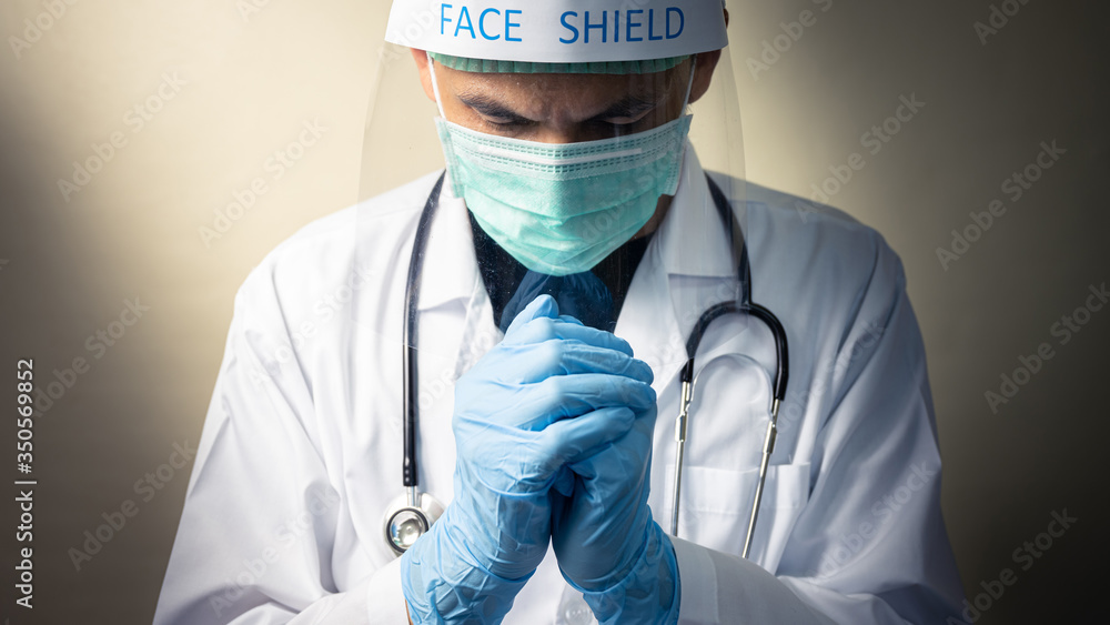 Closeup Asian male doctor wearing face shield and Personal Protective ...