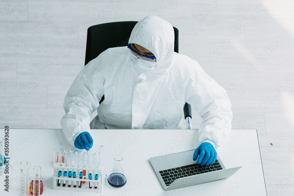 Lab Technician in Personal protective equipment PPE suit Vaccines ...