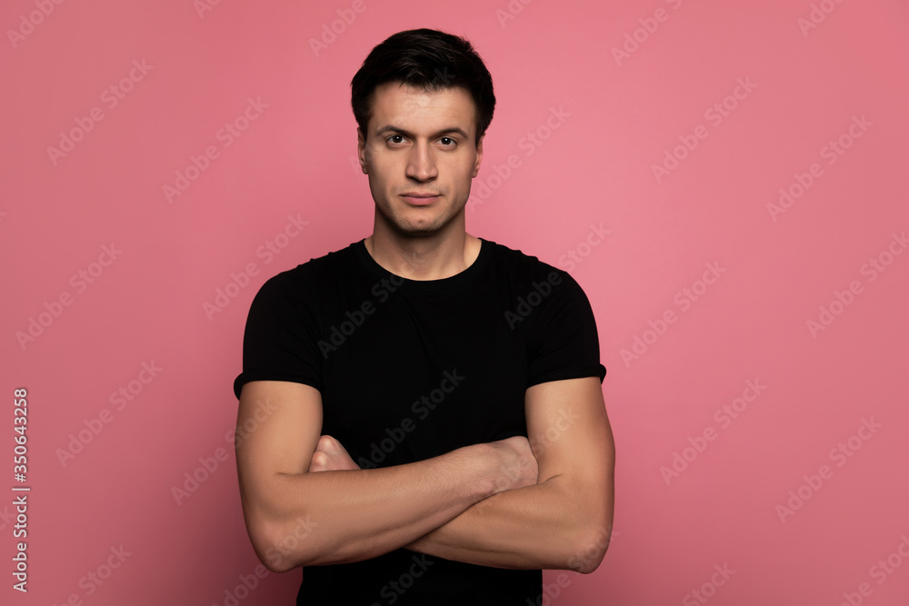 True man. Close-up photo of attractive young man in a black t-shirt ...