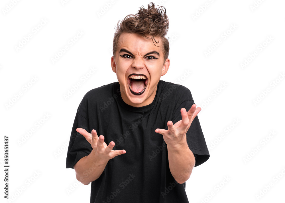 Rebellious teen boy dressed in black, isolated on white background ...