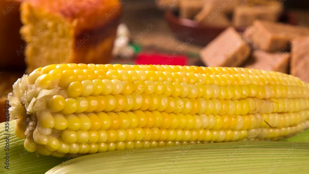 Vidéo Stock Slide shot corn boiled with smoke. Table of brazilian festa ...