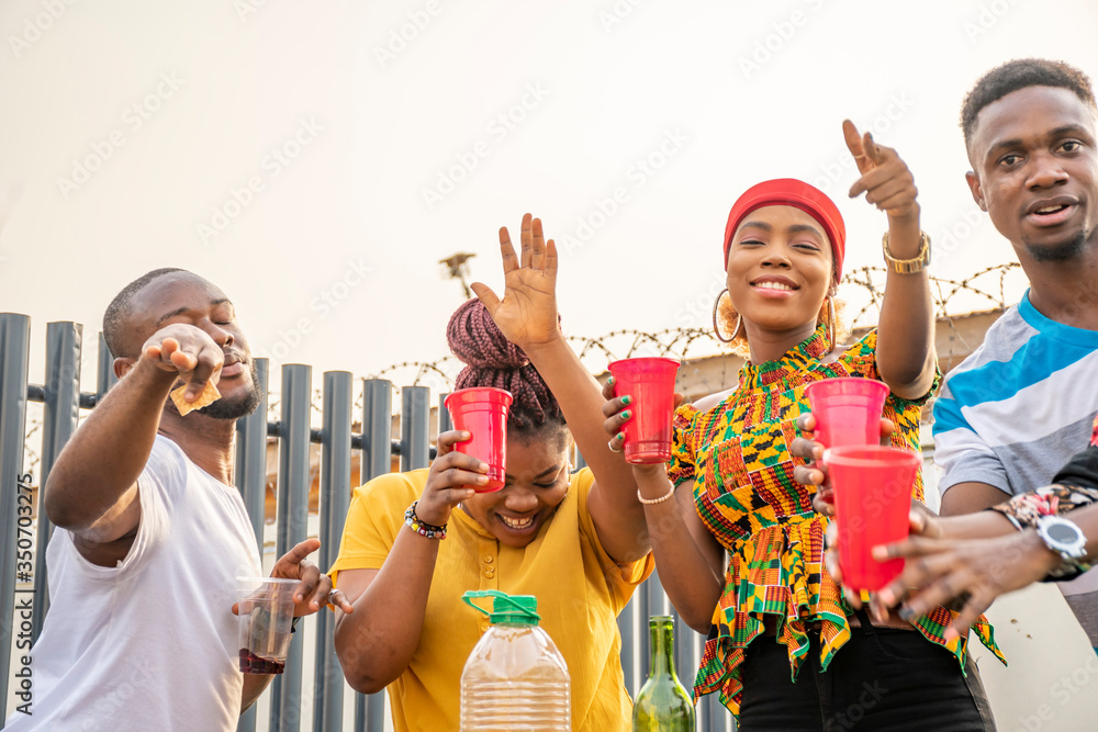 young african adults throwing a party, having fun Stock Photo | Adobe Stock