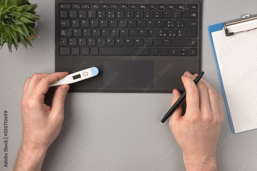 Medical worker checking the temperature measurment results. Working ...