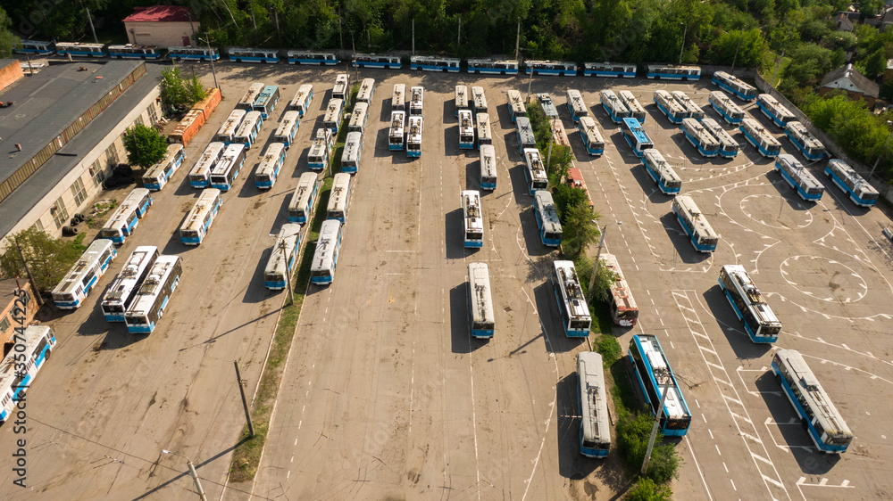 Many trolleybuses parked in front of the trolley depot hangar. Social ...