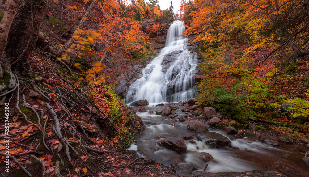 Beulach Ban Falls with its gushing water fall in an autumn forest ...