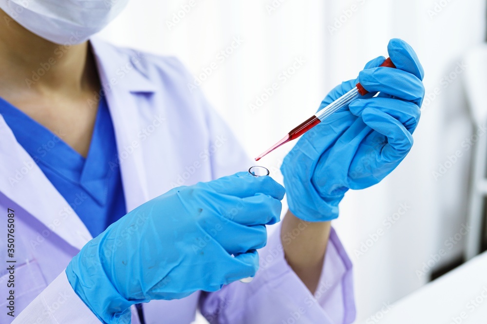 Scientist holding Coronavirus covid-19 infected blood sample tube DNA ...