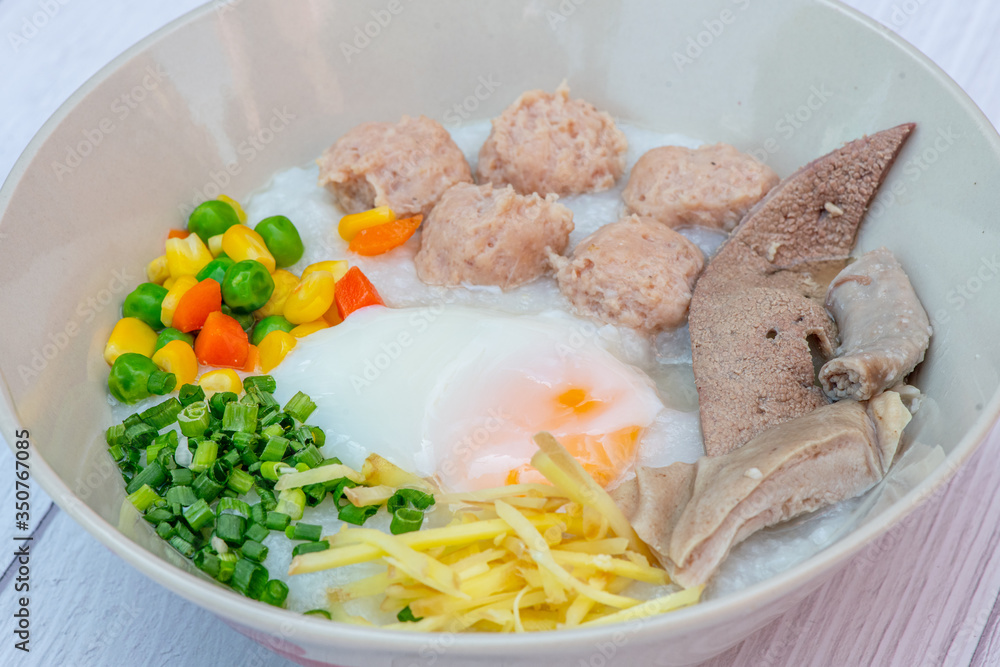 Delicious Thai Hong Kong Style Congee mixed with pork, meat, and pork ...