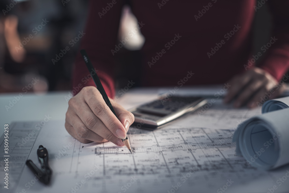Architect working on blueprint. Architects workplace - architectural ...