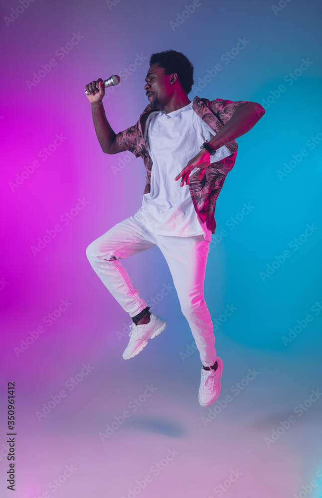 African-american male singer portrait isolated on gradient studio ...