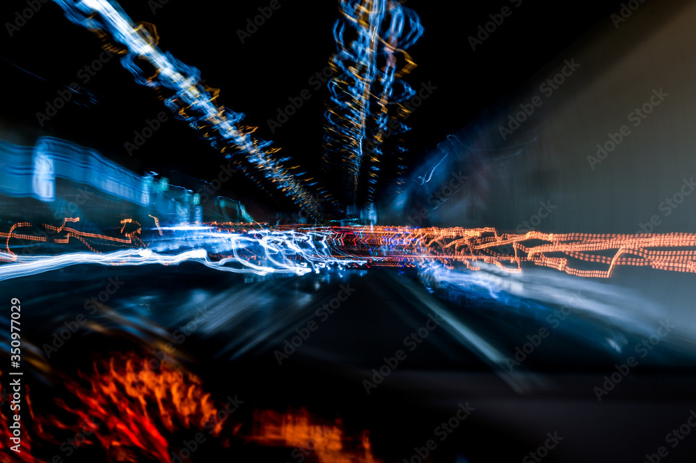 Drunk driving. View from eyes of a drunken driver. Long exposure ...
