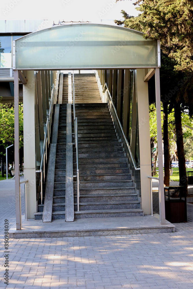 Stairs of pedestrian overpass. Image of footbridge. Indoor elevated ...