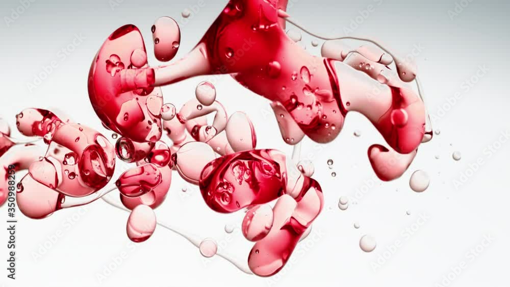 Sweet red juice in beauty close-up. Transparent red oil bubbles and ...