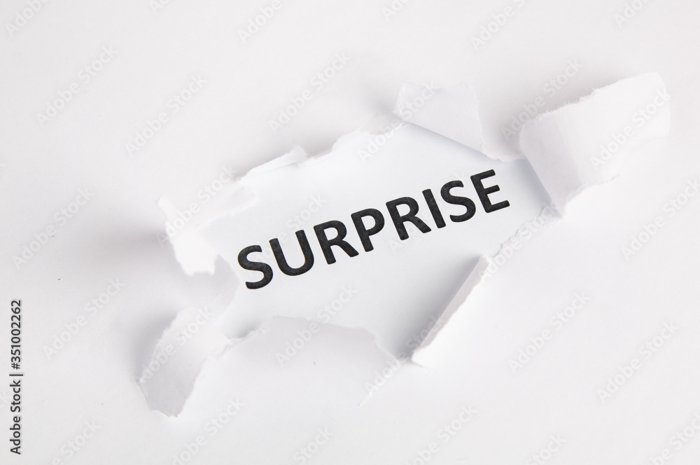 word surprise written under torn white paper Stock Photo | Adobe Stock