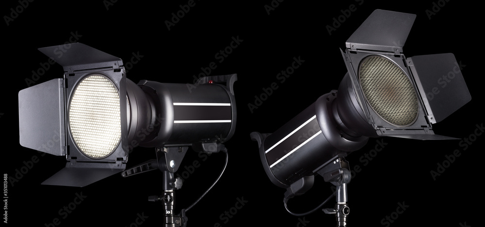 Set of photography studio flash isolated on black background with lamp ...