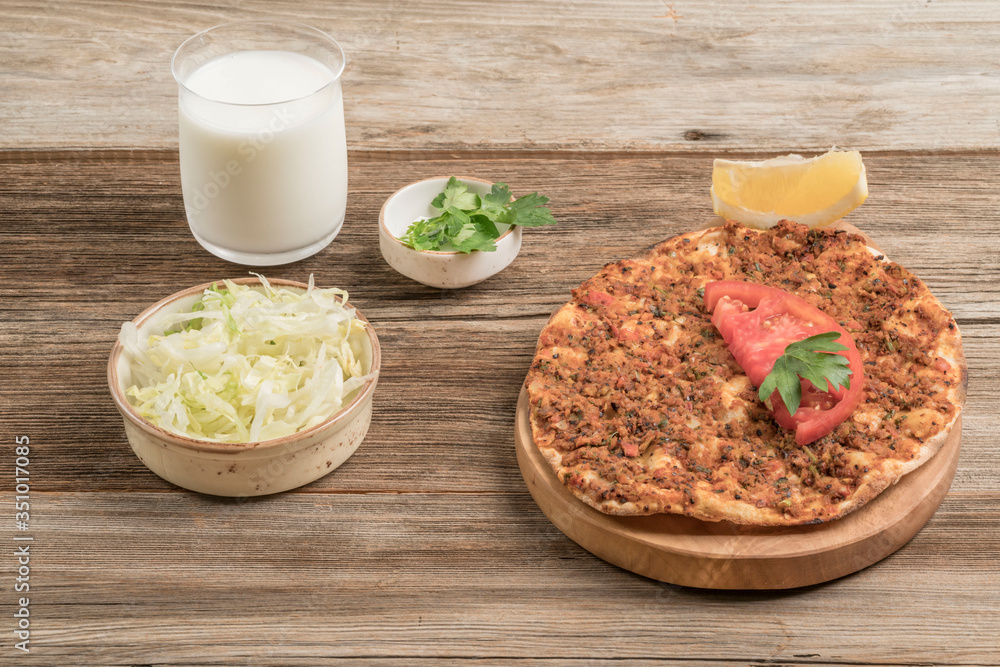 Turkish pizza, made of ground beef and onion Stock Photo | Adobe Stock