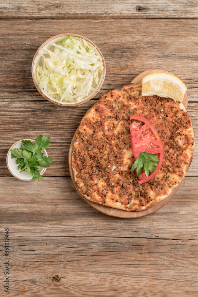 Turkish pizza, made of ground beef and onion Stock Photo | Adobe Stock
