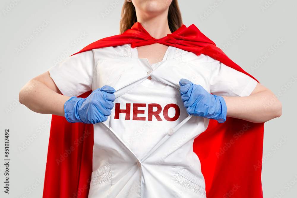 The doctor, wearing gloves and a superhero Cape, tears open the coat ...