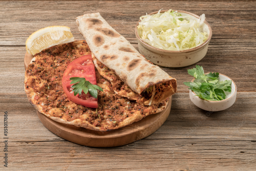 Turkish pizza, made of ground beef and onion Stock Photo | Adobe Stock