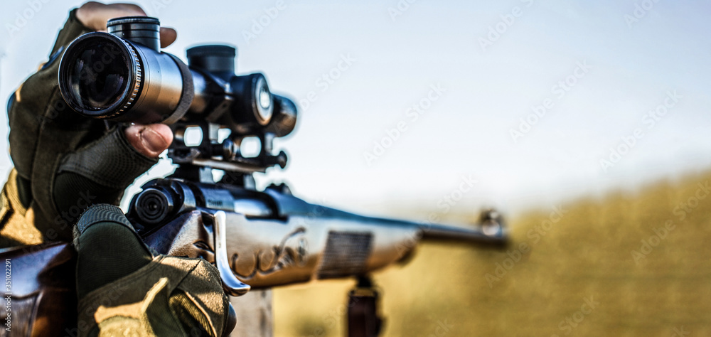 Hunt hunting rifle. Hunter man. Hunting period. Male with a gun. Close ...