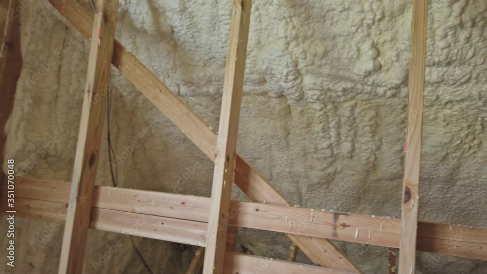 New home construction with installation of termal insulation installing ...