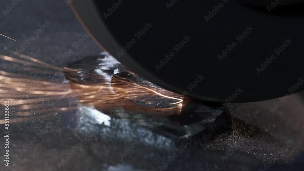Grinding wheel contact with the iron causes sparks. Impressive spark ...