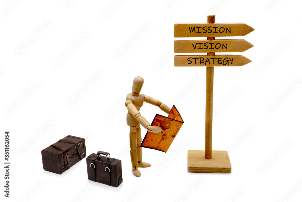 MANIKIN WITH LUGGAGE AND ROAD SIGN WITH MISSION VISION STRATEGY ...