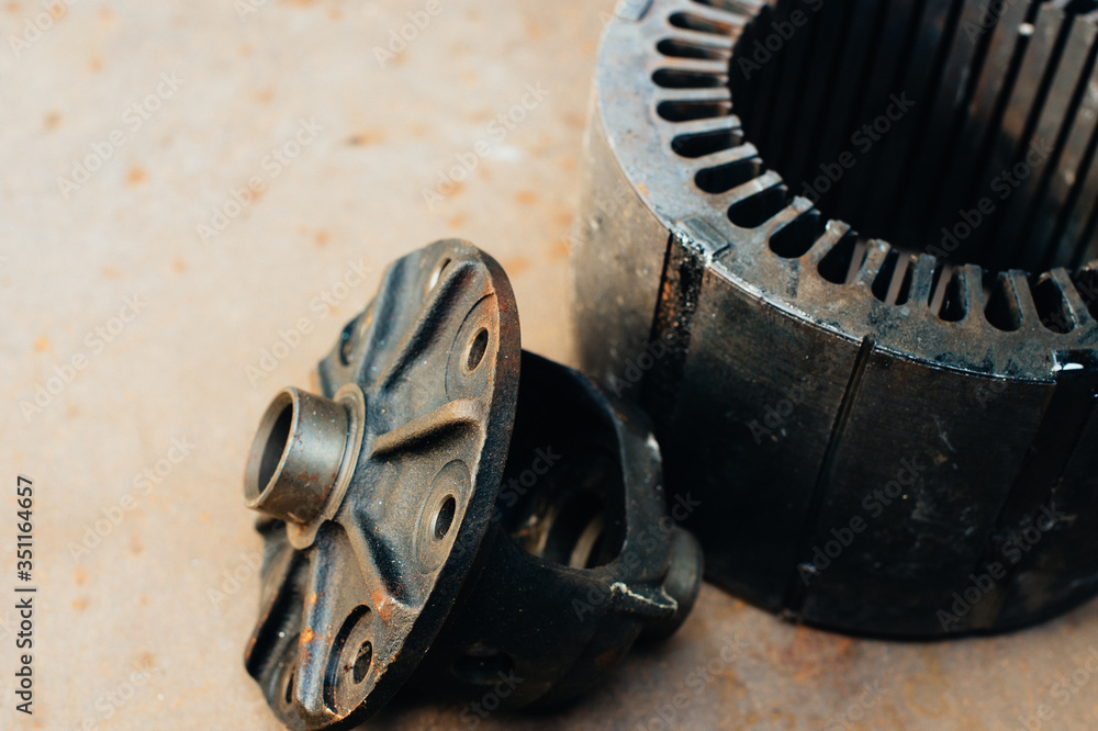 Old charred motor stator core with grooves. Scrap metal. Close-up ...