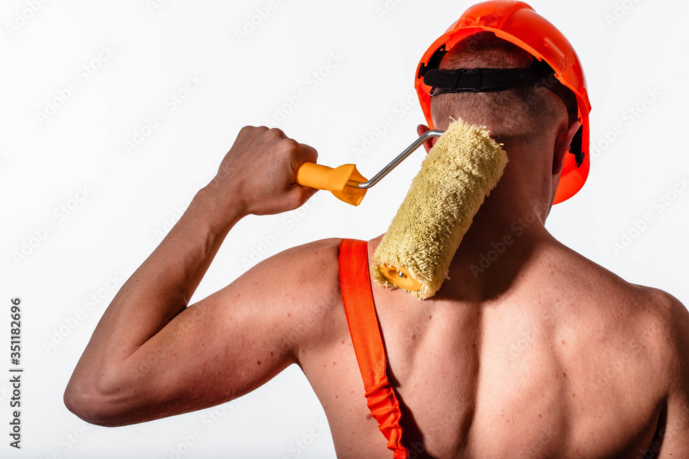 Sexy construction worker on a white background. Builder with a helmet ...