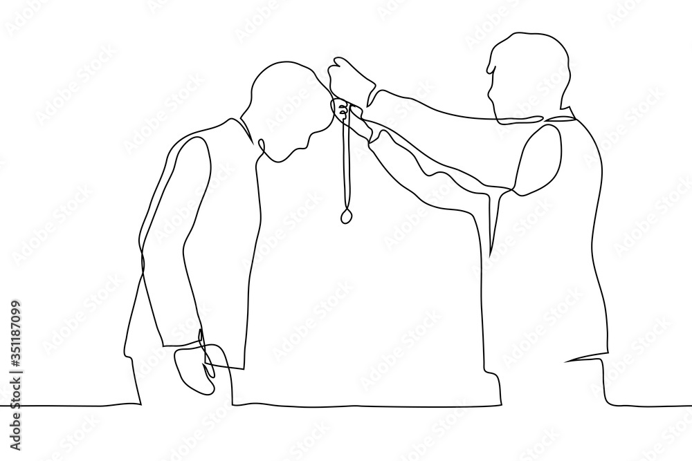 The silhouette of two men, one of which hangs a medal on a ribbon ...