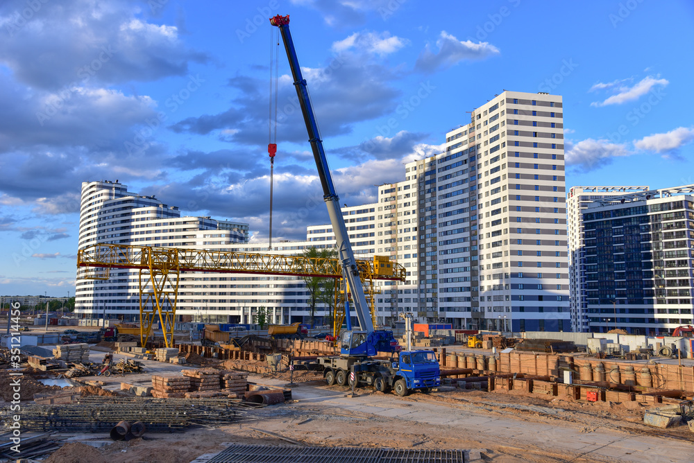 Mobile auto cranes working at construction site an underground tunnel ...