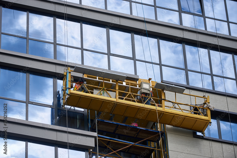 Scaffold elevator insulated wall facade with mineral wool. Modern ...