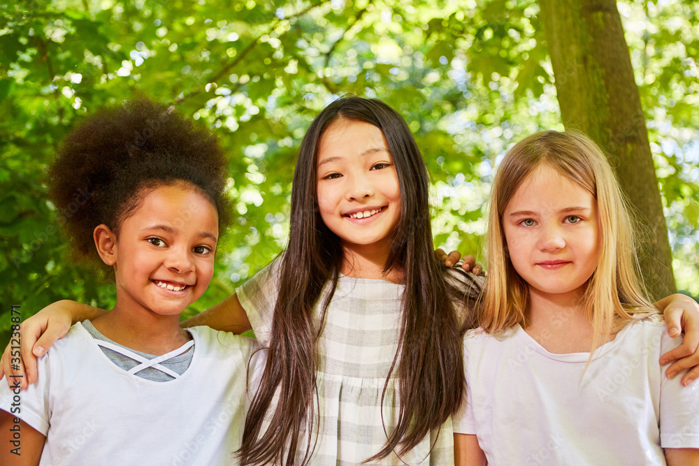Three girls in the international kindergarten Stock Photo | Adobe Stock