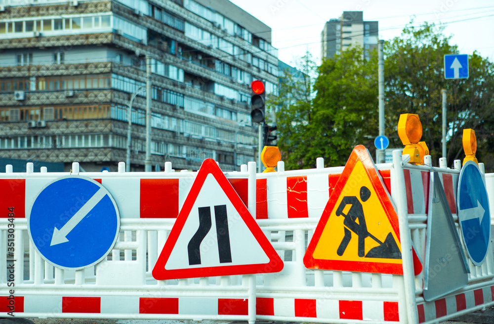 Traffic signs on a white-red background. Cityscape with traffic signs ...