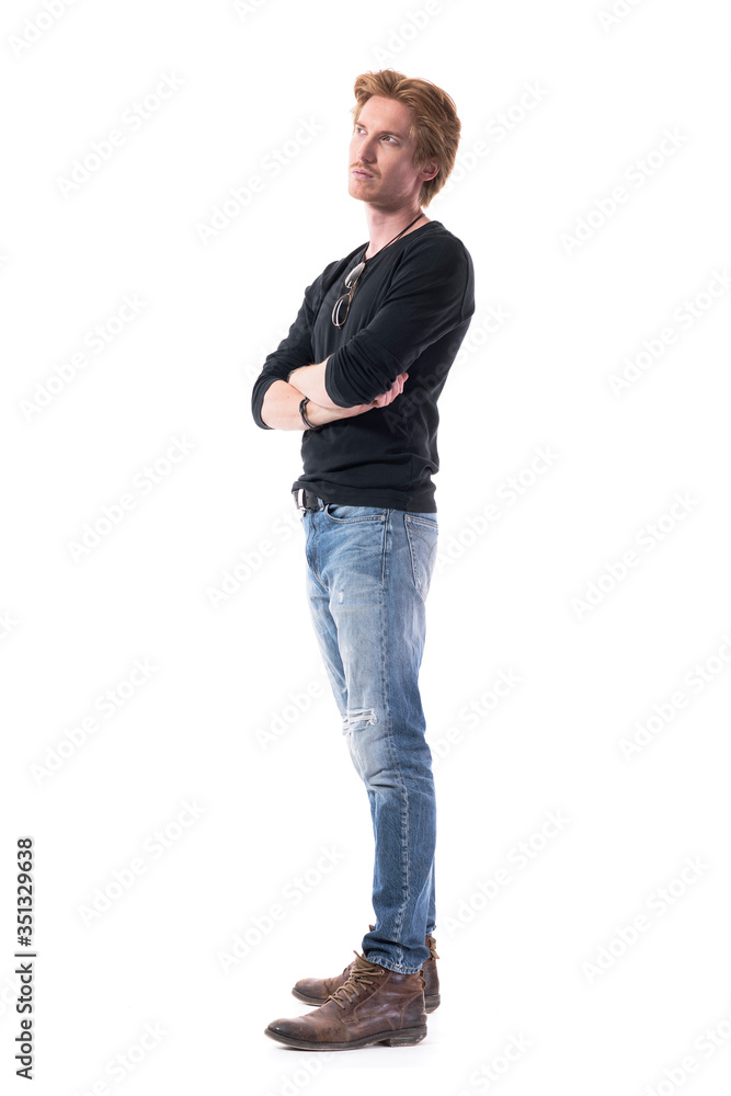 Side view of skeptical judging young man looking up with uncertainty ...